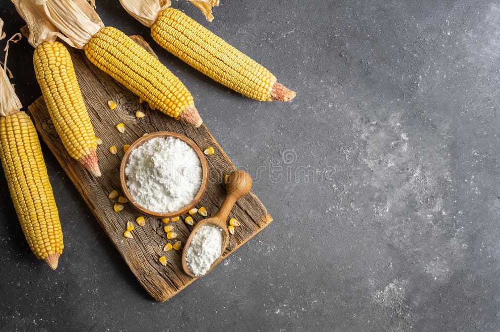Corn Starch in Bowl and Spoon with Dried Corn Groats, Kernels on Rustic ...