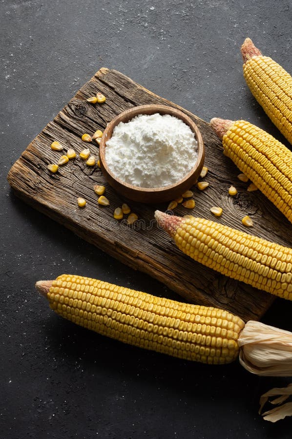 Corn Starch in Bowl and Spoon with Dried Corn Groats, Kernels on Rustic ...