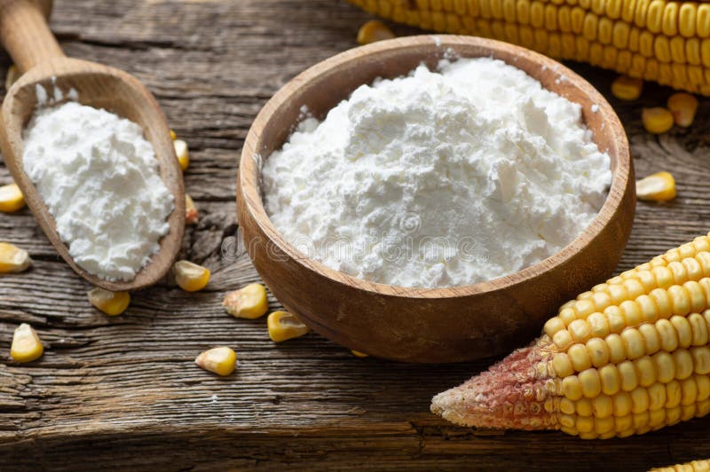 Corn Starch in Bowl and Spoon with Dried Corn Groats, Kernels on Rustic ...