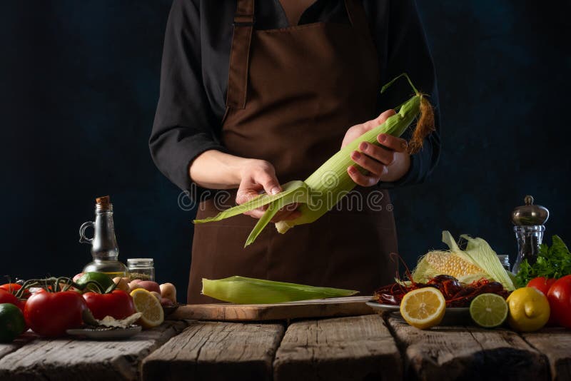 Corn with Vegetables in the Photo, the Chef Peels Corn for Cooking. on ...