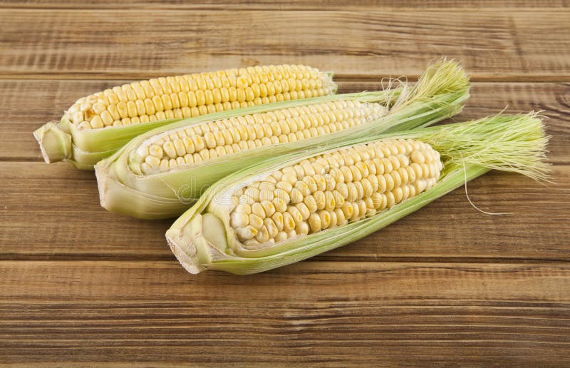 Corn on a wooden table stock image. Image of grain, maize - 183735507
