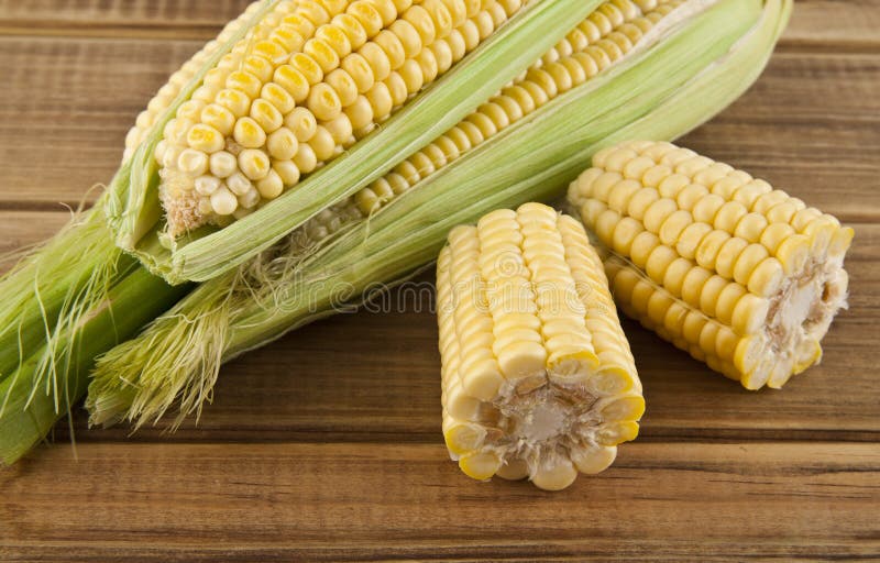 Corn on a wooden table stock image. Image of natural - 183735679