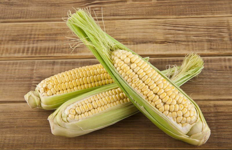 Corn on a wooden table stock image. Image of ingredient - 183735863