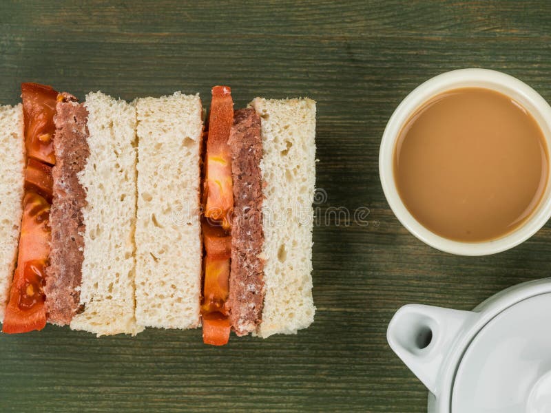 Corned Beef and Tomato White Bread Sandwich with a Cup of Tea Stock ...