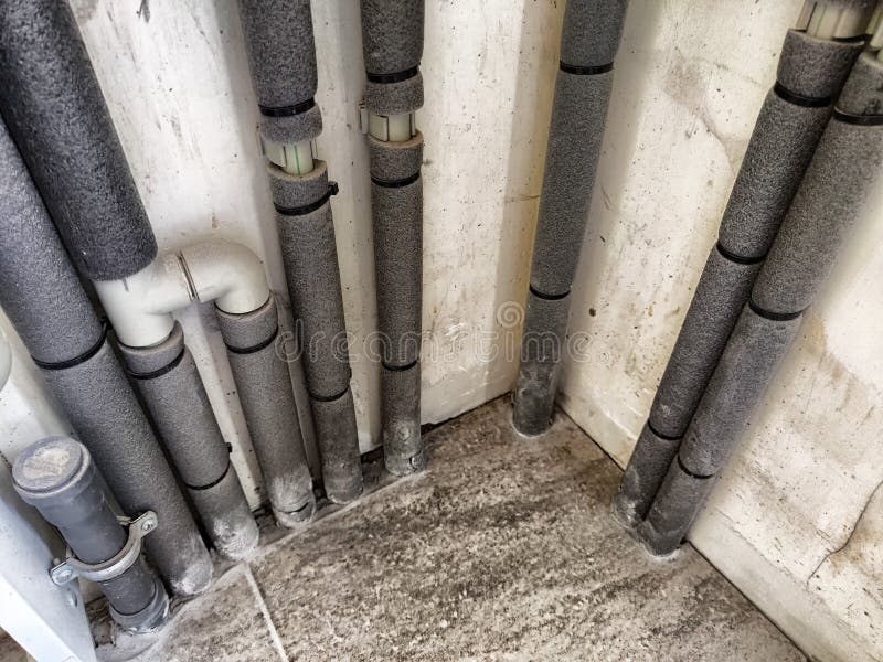 Inspection of Insulated Pipes in a Basement Corner To Ensure Plumbing ...