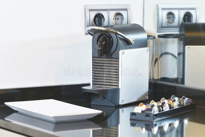 Corner of a Black Stone Countertop in a Kitchen with a Pod Coffee ...