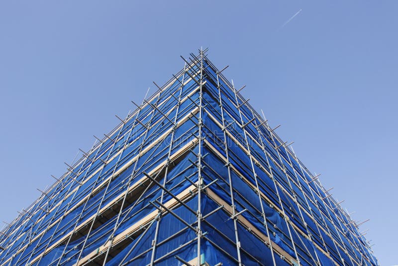 Corner of blue scaffolding stock image. Image of construction - 23055891
