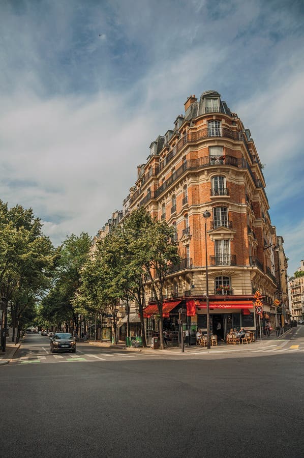 Corner Brick Building with Restaurant and Trees in Paris. Editorial ... Corner Brick Building with Restaurant and Trees in Paris. Editorial ...