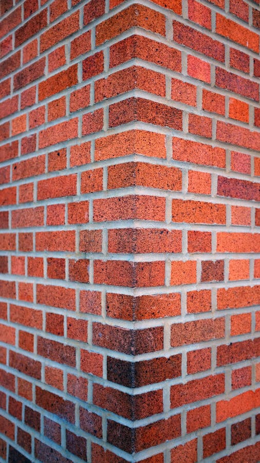 Corner of Bright Red Brick Building Vertical Stock Image - Image of ...