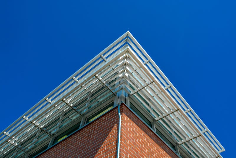 Corner of a Building Roof with Shadowing Grid Above the Windows. Stock ...