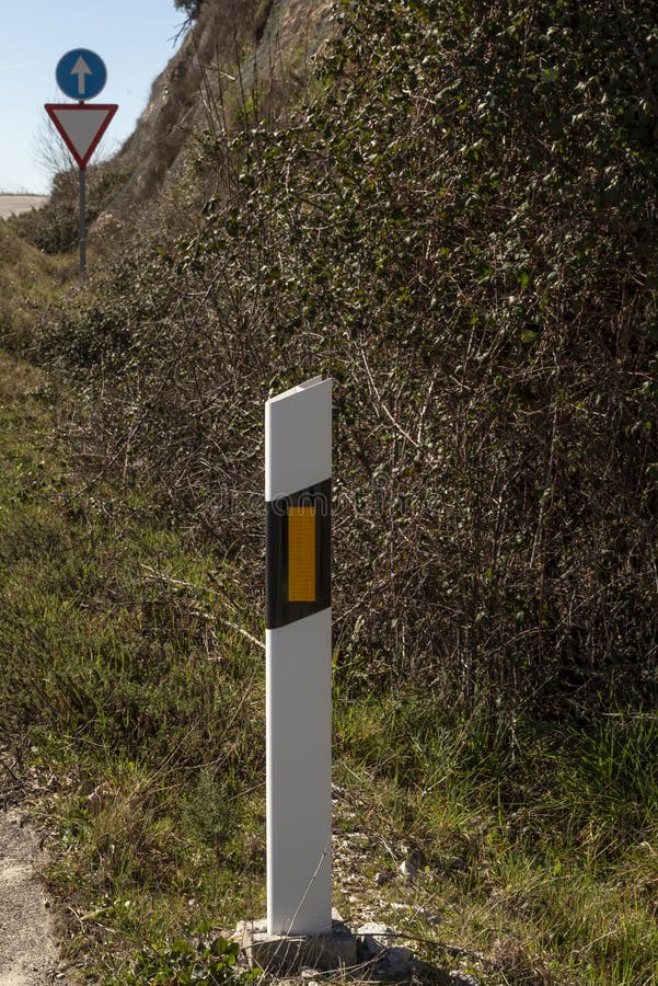 Corner Bumps and Traffic Signs on a Conventional Road Stock Photo ...