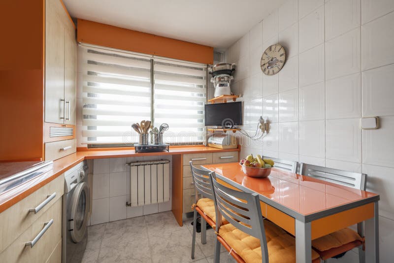 Corner of a Conventional Kitchen with Bright Orange Cabinets Combined ...