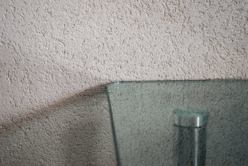 Corner of a Glass Table on a Background of a Light Wall. Space for ...