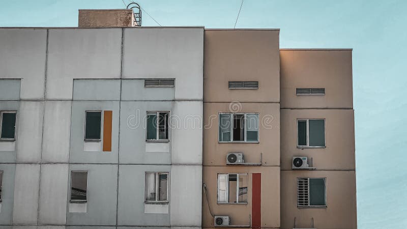 The Corner of a High-rise Building Against a Blue Sky Background Stock ...