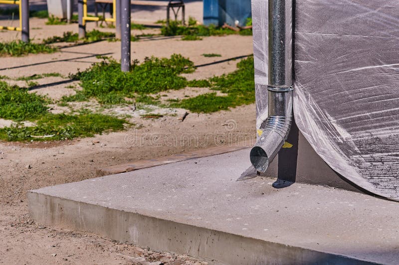 Corner of the House during the Reconstruction. Rain Drain Pipe. the ...