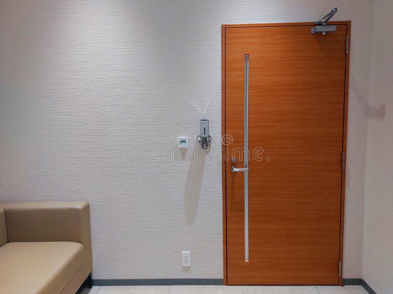 A Corner Inside a Modern Room with Wall and Door a and a Small Sofa ...