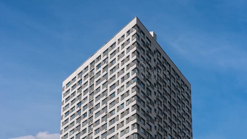 The Corner of a Modern Building Against the Blue Sky, Background. Stock ...