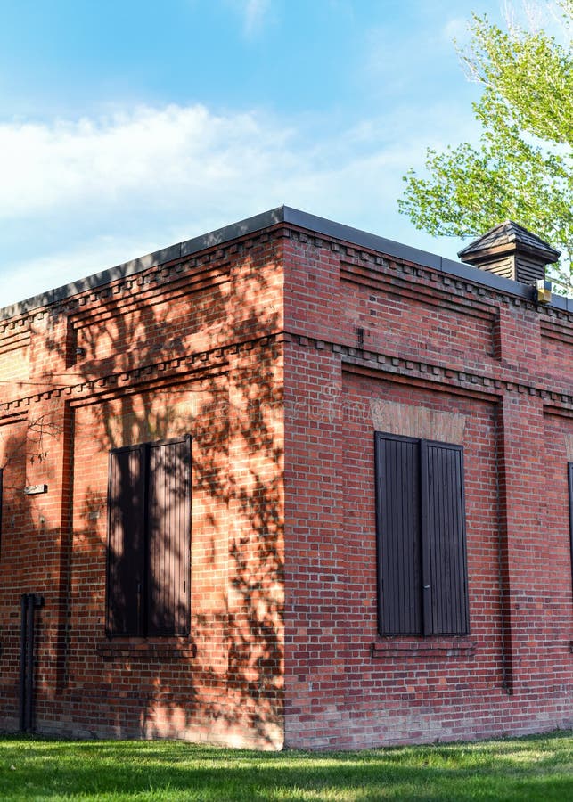 Corner of Old Brick Building with Shuttered Windows Stock Image - Image ...