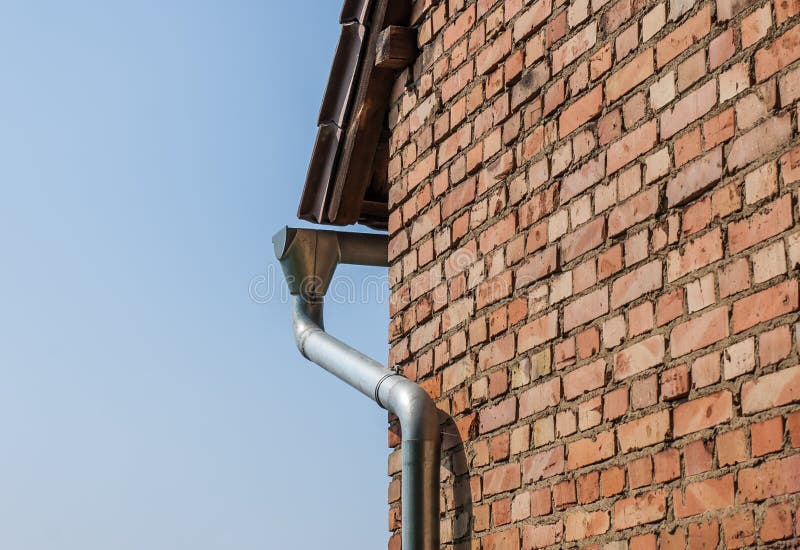 Brick Wall and Rain Gutter stock image. Image of pipe, city - 188401