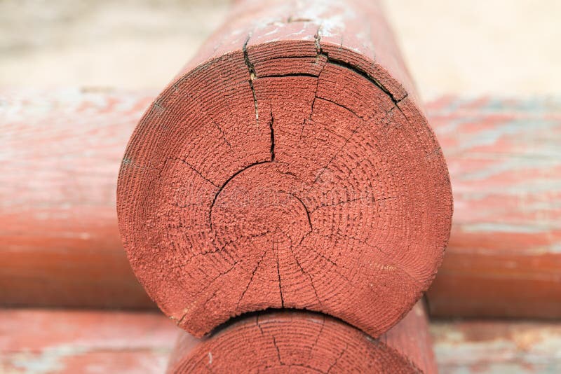 Corner of Red Logs in the Sand Stock Photo - Image of feature, pine ...