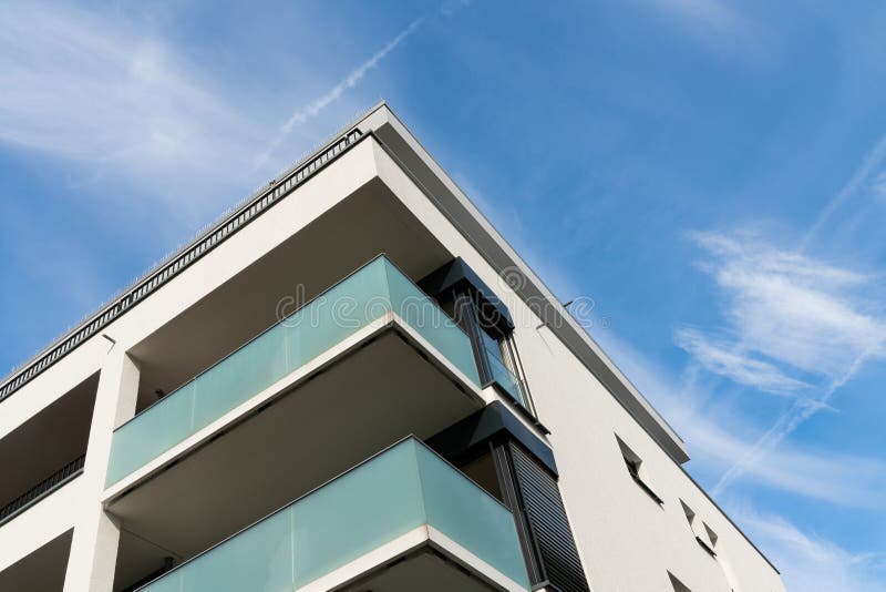 Corner of a Residential Building with Balconies Against a Blue Sky ...