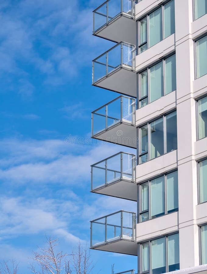 Corner of Residential High Rise Building on Blue Cloudy Sky Background ...