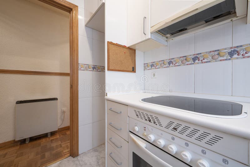 Corner of a Small Kitchen with White Furniture with a Ceramic Hob and ...