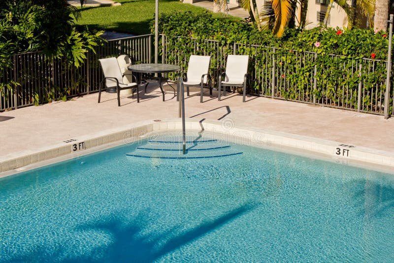 Corner of a swimming pool stock photo. Image of grass - 23334330