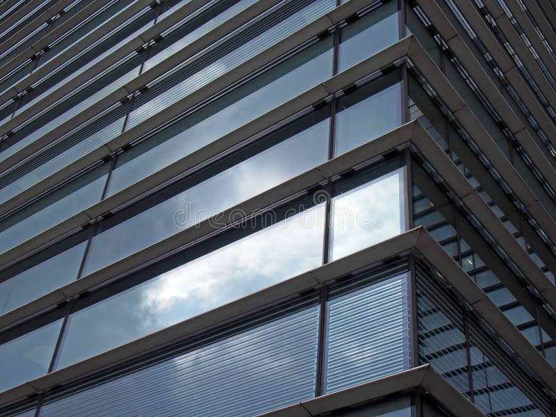 Corner View of a Modern Futuristic Office Building with Blue Sky and ...