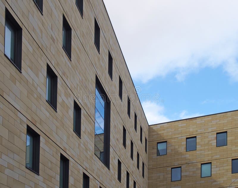 Corner View of a Modern Stone Building with Geometric Repeating Pattern ...