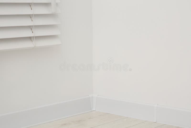 Corner of White Wall with Baseboard Indoors Stock Image - Image of ...