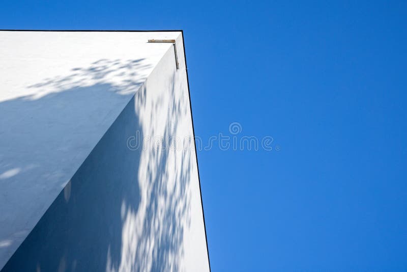 Corner of White Walls with Blurred Shadows Pattern is Under Blue Sky ...