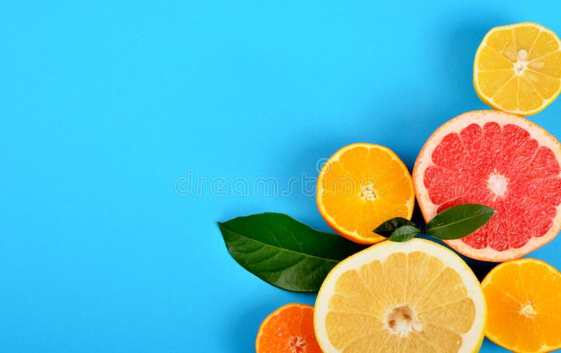 Corners Placed and Sliced Cut Citrus on a Blue Background Stock Image ...