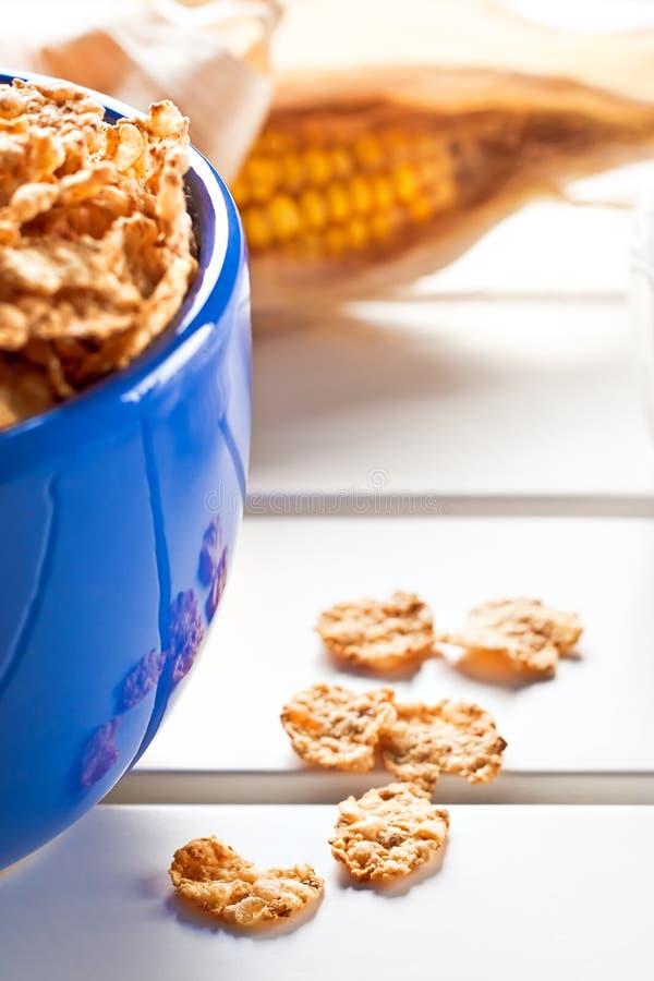 Cornflakes in a blue bowl stock image. Image of diet - 47703263