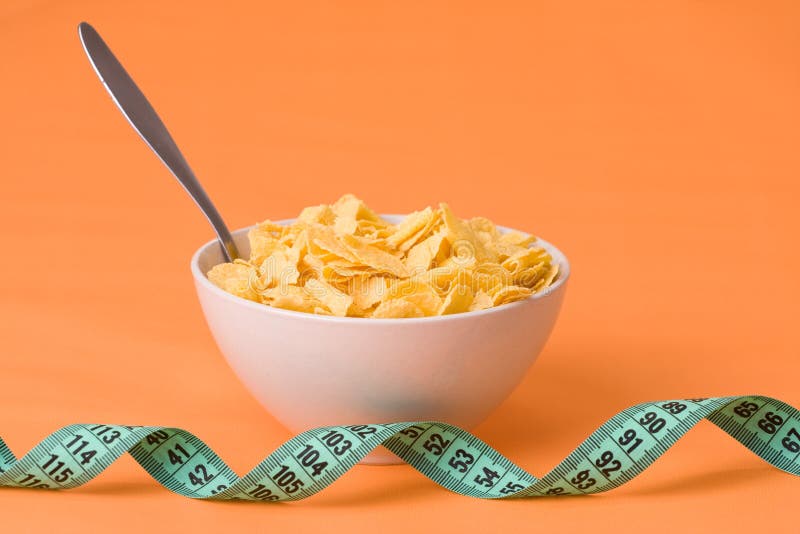 Cornflakes in Bowl and Measuring Tape Stock Photo - Image of fitness ...