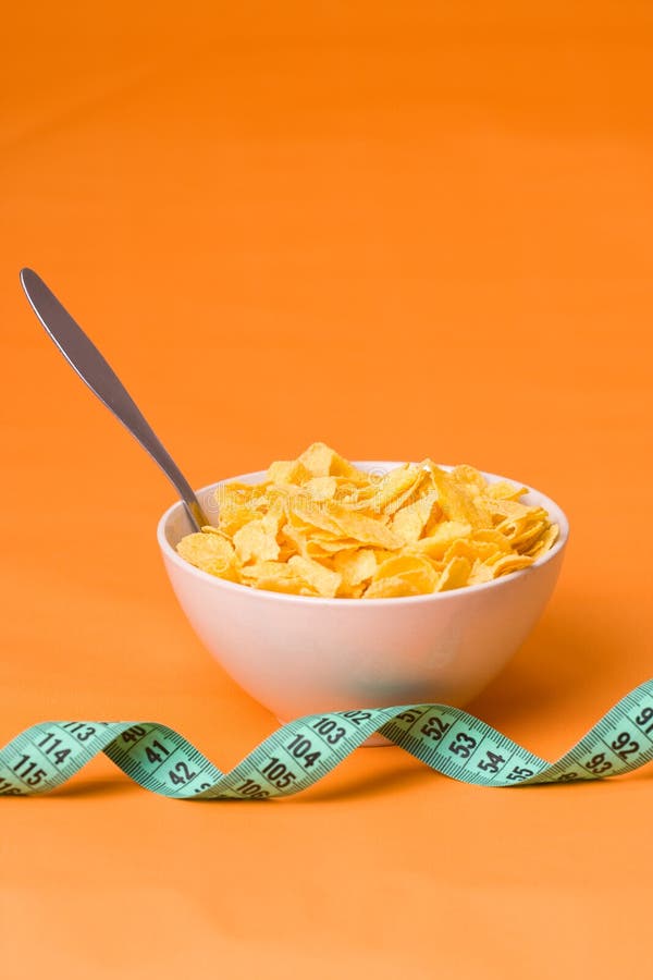 Cornflakes in Bowl and Measuring Tape Stock Photo - Image of crunchy ...
