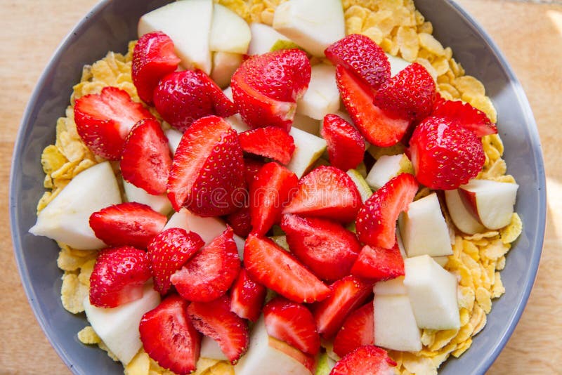 Cornflakes with fruit stock image. Image of food, juicy - 249795725