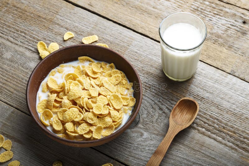 Cornflakes with milk stock photo. Image of breakfast - 129275134