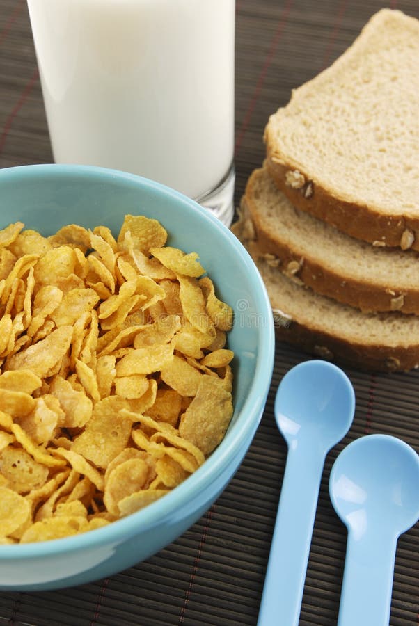 Cornflakes and milk stock photo. Image of grain, glass - 24372080
