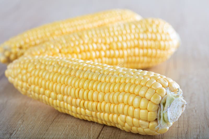 Corns on a wooden surface stock image. Image of sweet - 74742043