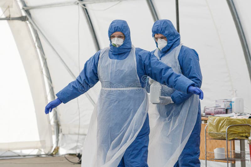 Coronavirus Checkpoint. Medics with Protective Costumes Take Samples of ...