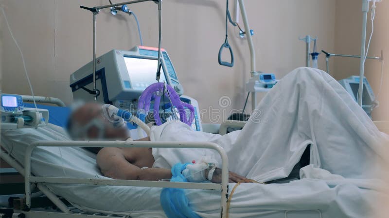 Coronavirus Patient Breathing Using a Mechanical Ventilator Stock Video ...