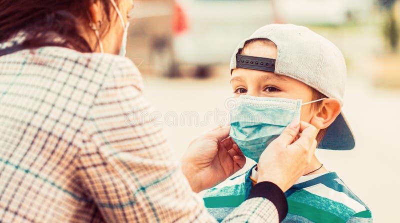 Coronavirus Quarantine. Mother Puts Her Son a Face Protective Mask ...