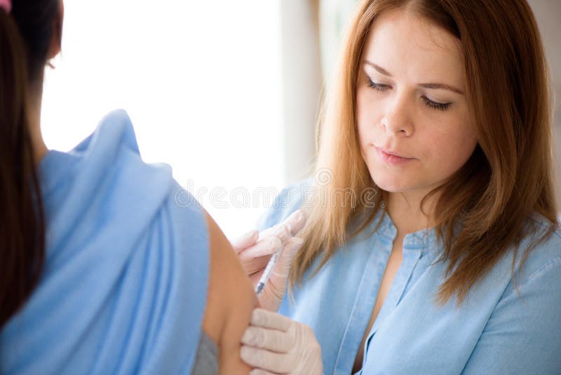 Coronavirus Vaccine. a Doctor Makes a Coronavirus Vaccine at a Hospital ...