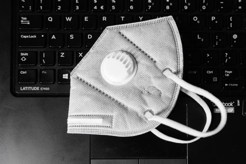 Coronavirus Mask Placed on a Computer Keyboard Editorial Photography ...