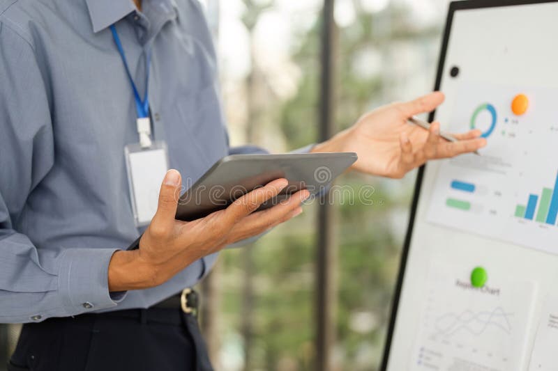 Corporate Data Review. Professional Using Tablet while Explaining ...