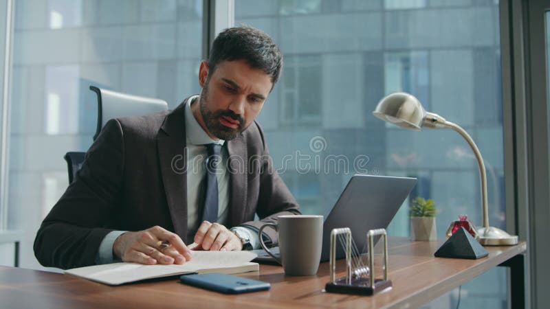 Corporate Employee Talking Webinar Sitting Office Desk Making Notes
