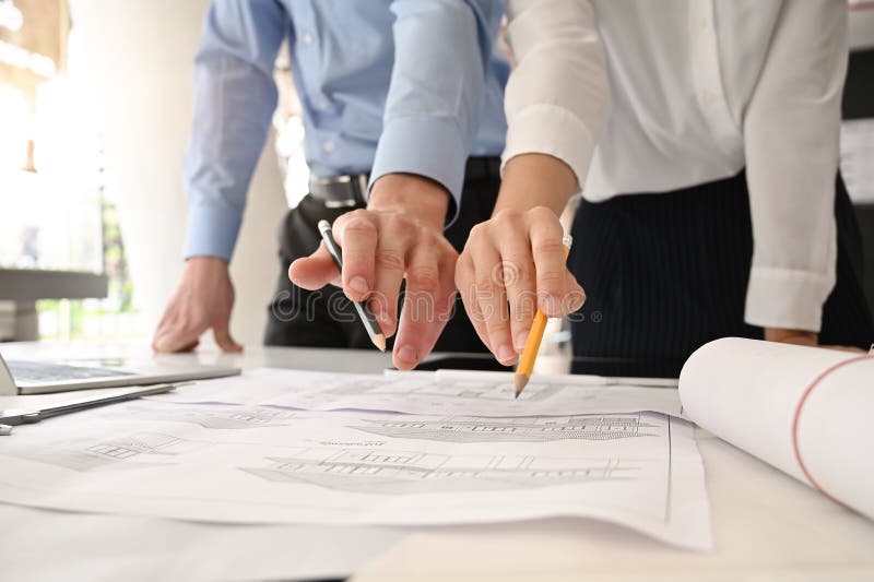 Corporate Engineer Hand Drawing Plan on Blueprint with Architect ...