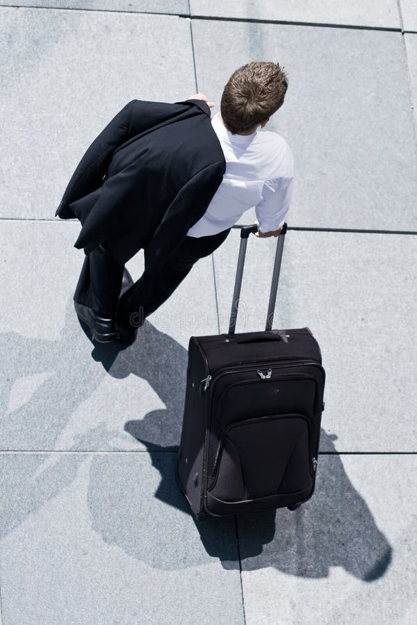 Corporate Man with Rolling Luggage Stock Photo - Image of person, black ...