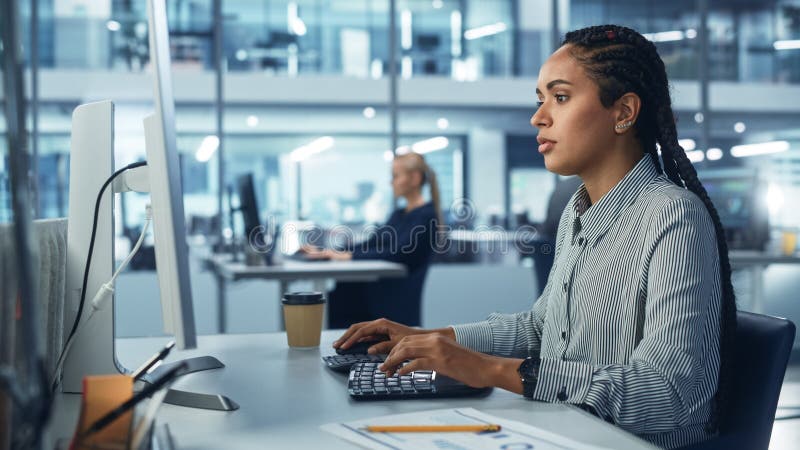 Corporate Office: Black Female it Technician Using Desktop Computer ...